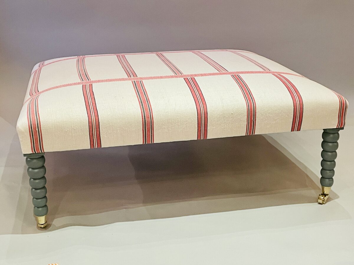A Bobbin Leg Ottoman in Antique Fabric | Miranda Willes